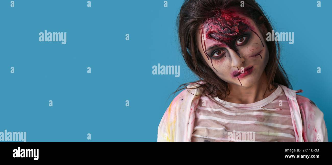 Scary zombie woman on blue background with space for text Stock Photo ...