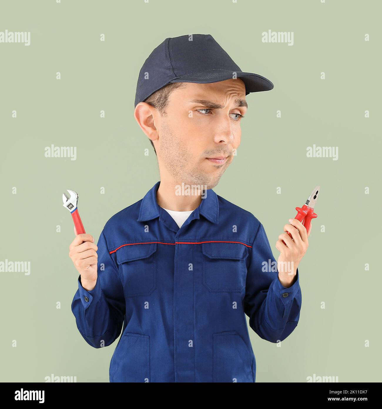 Funny car mechanic with big head and different tools on color ...