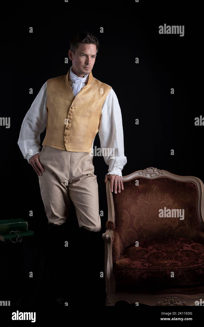 A Regency gentleman wearing a gold waistcoat and breeches Stock Photo ...