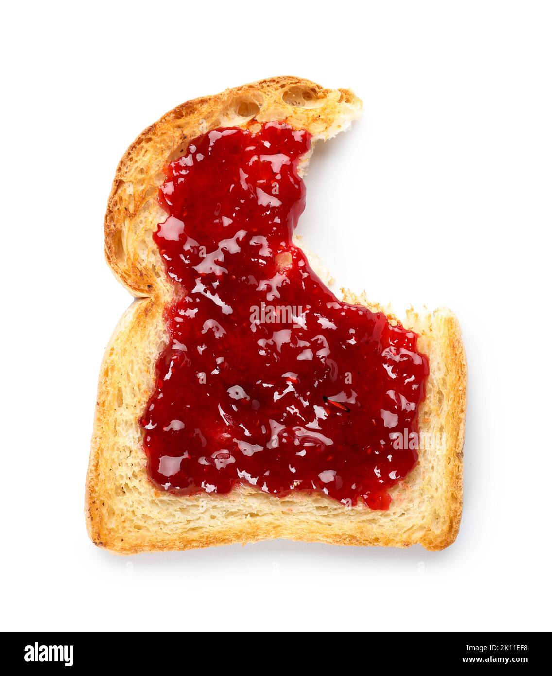 Bitten toast with jam on white background Stock Photo - Alamy