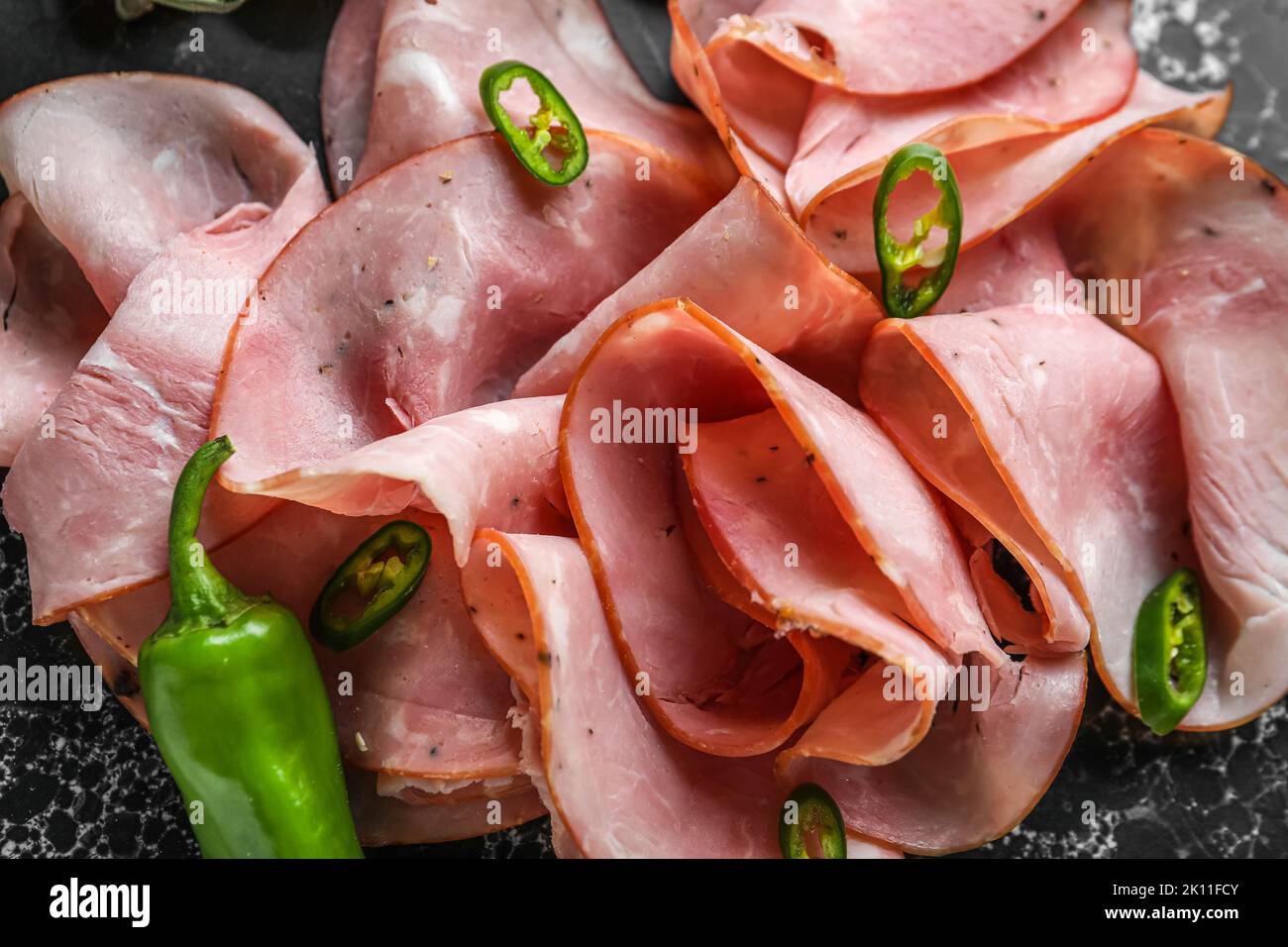 Slices of delicious ham with chili pepper, closeup Stock Photo - Alamy