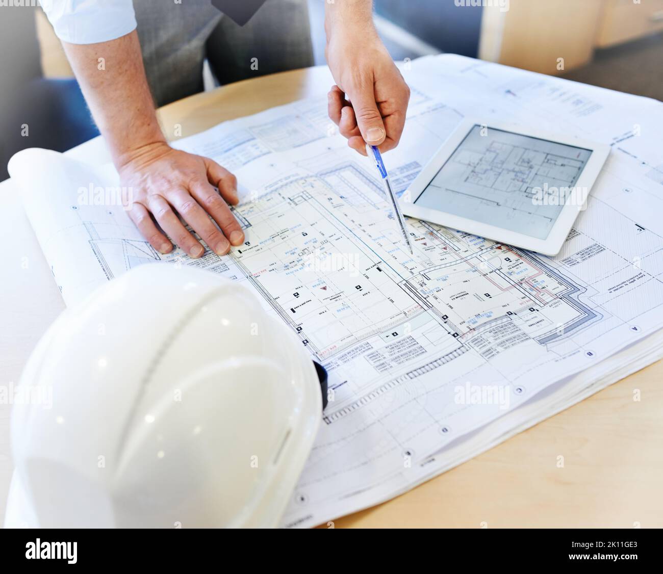 Everything needs to be perfect. an architects hands examining ...