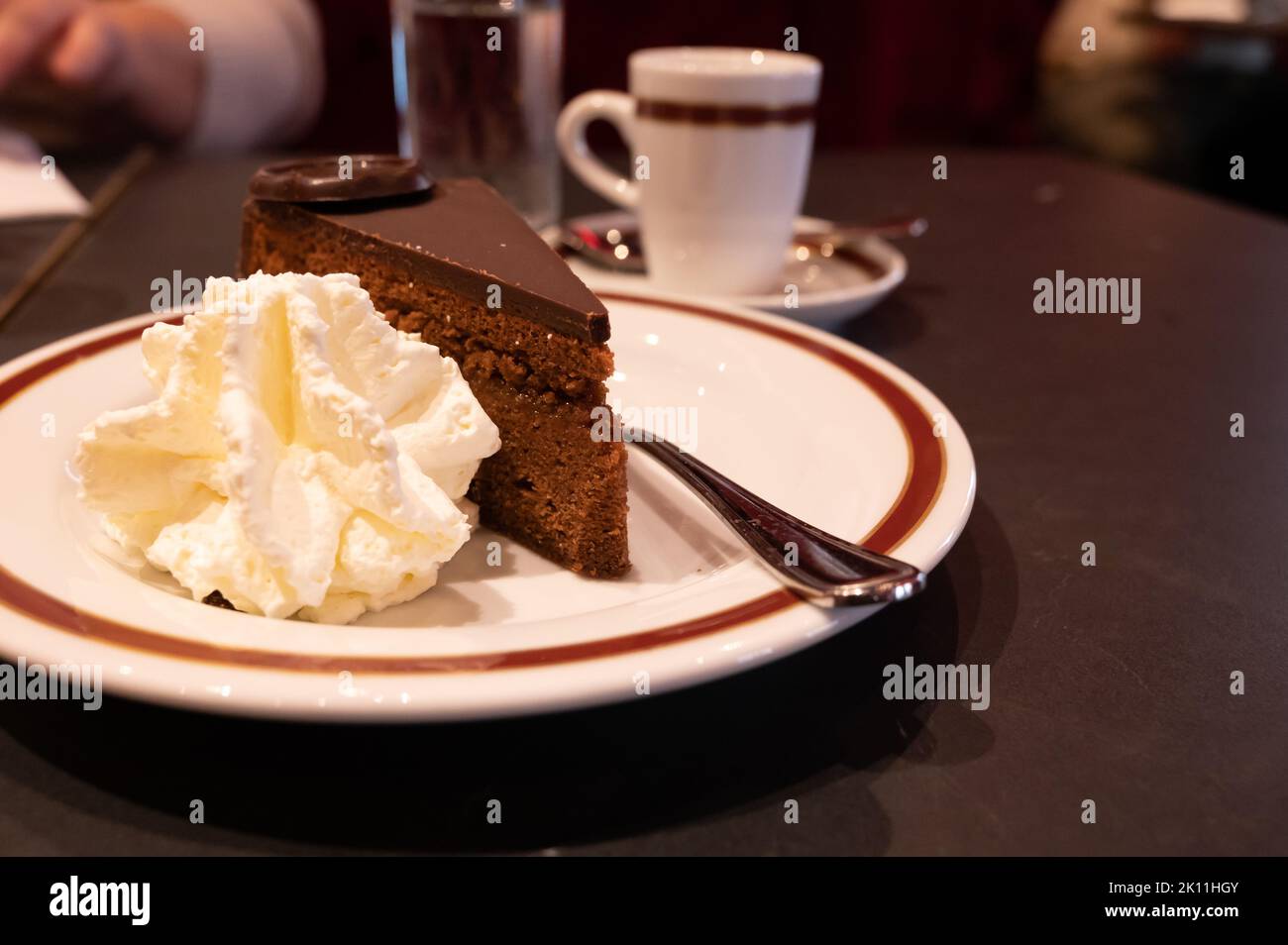 Piece of famous Sachertorte chocolate cake with apricot jam of Austrian ...