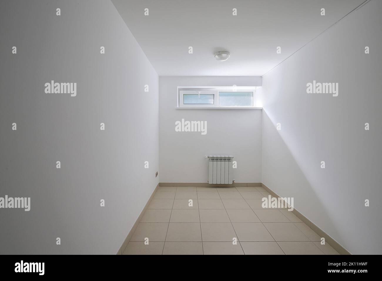 Small empty garage room with white walls inside the house Stock Photo ...
