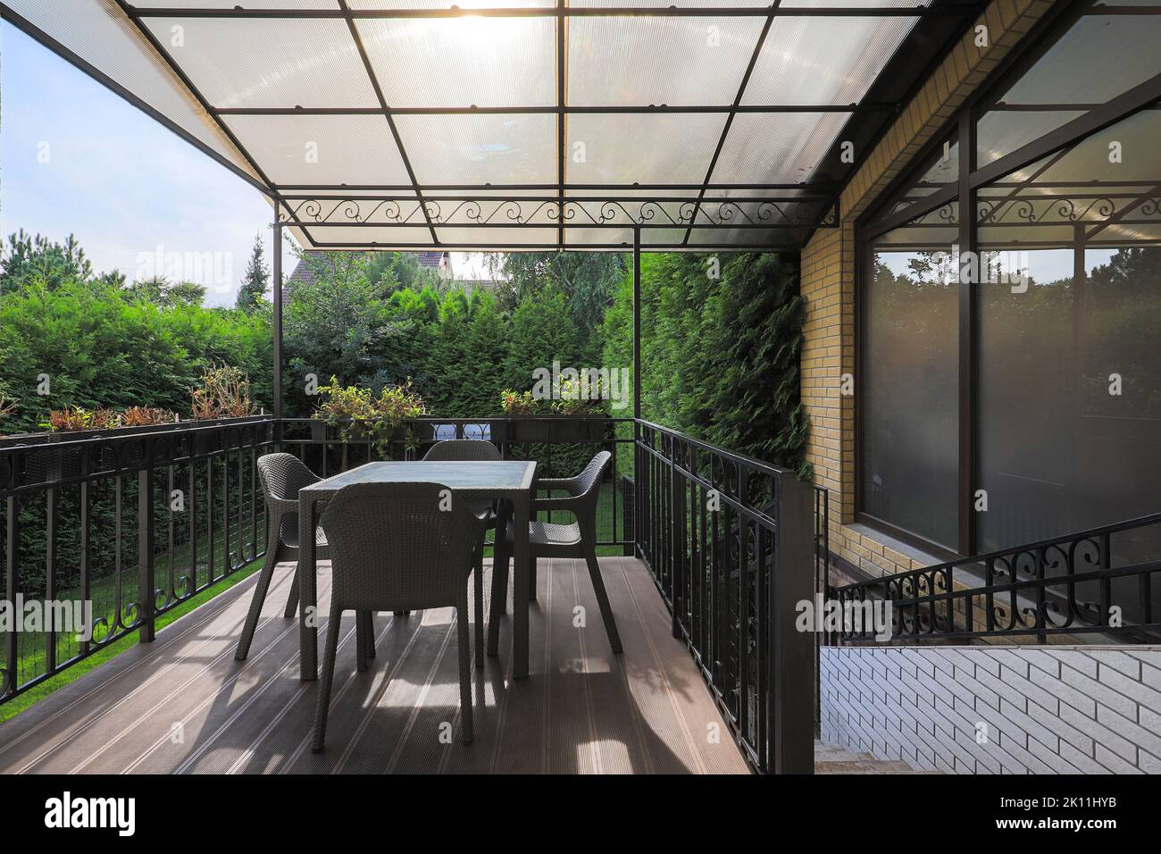 Dining table with chairs on the terrace Stock Photo - Alamy