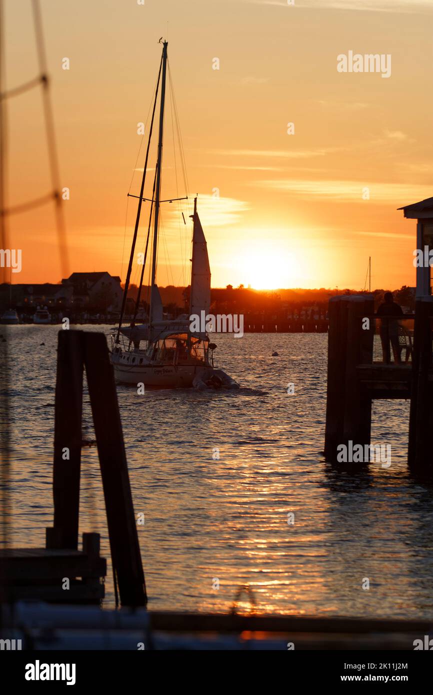 Boat sailing in the sunset outside Newport, Rhode Island Stock Photo ...