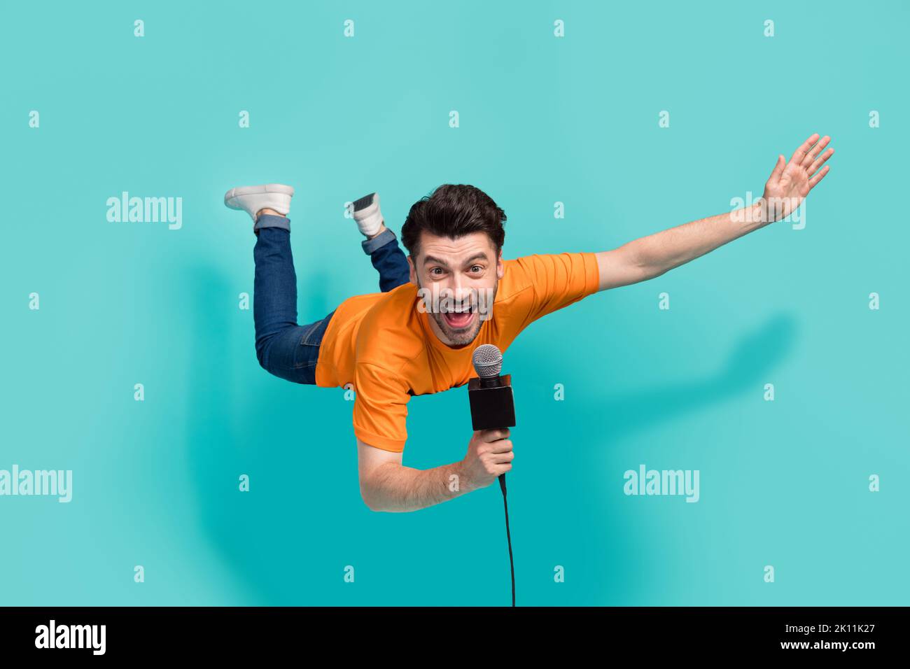 Full size photo of active guy reporter hold mic tell news on tv video ...