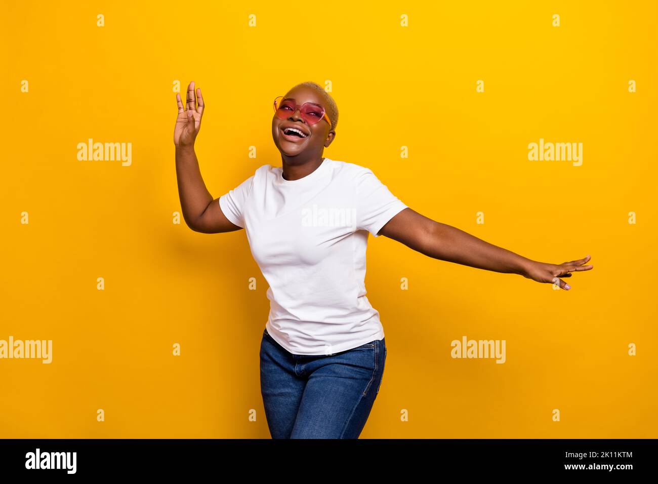 Photo of overjoyed lady woman music lover dance has chill raise arms ...