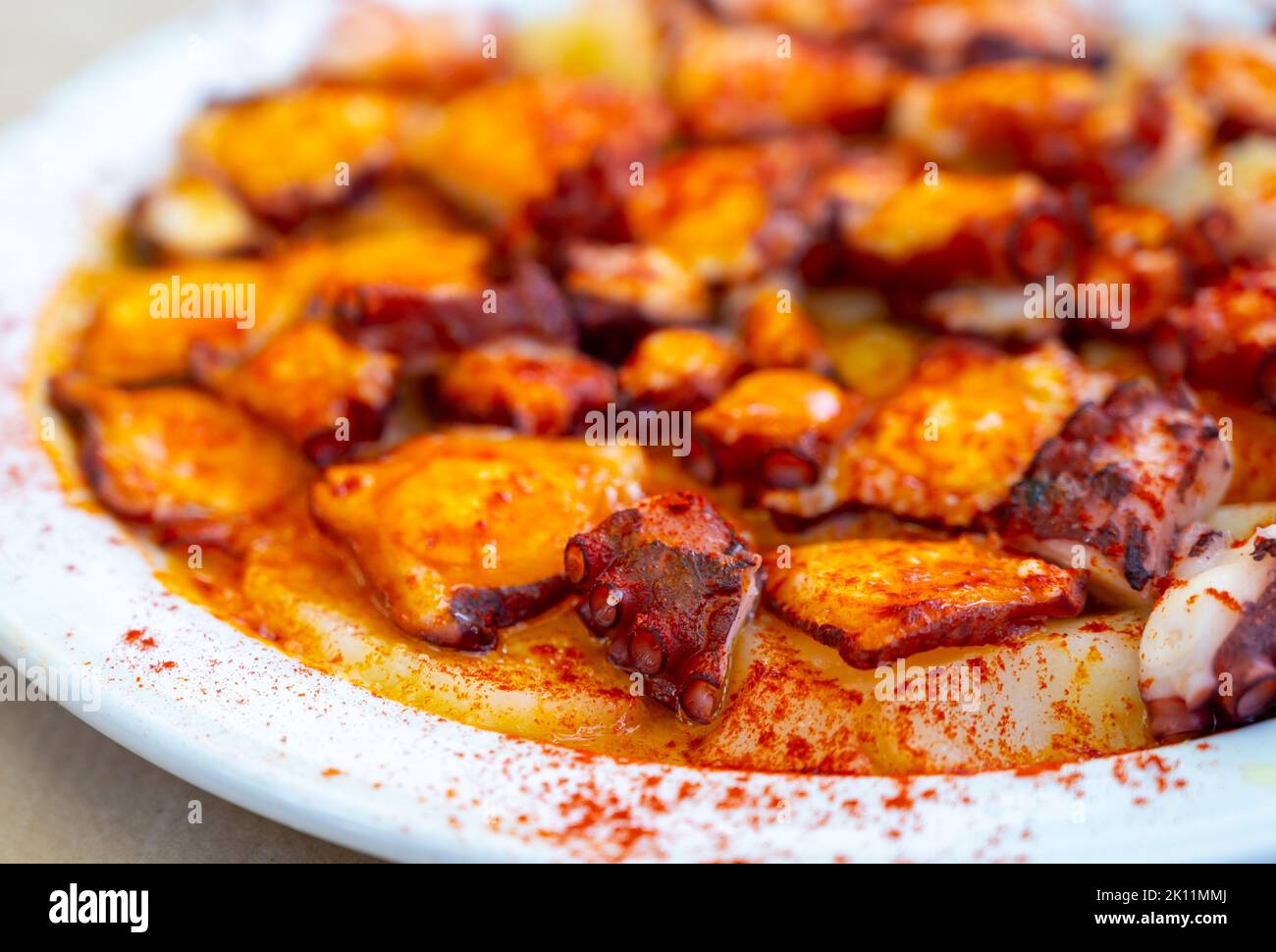 Tasty seafood, grilled octopus galician style with red pimento paprika ...