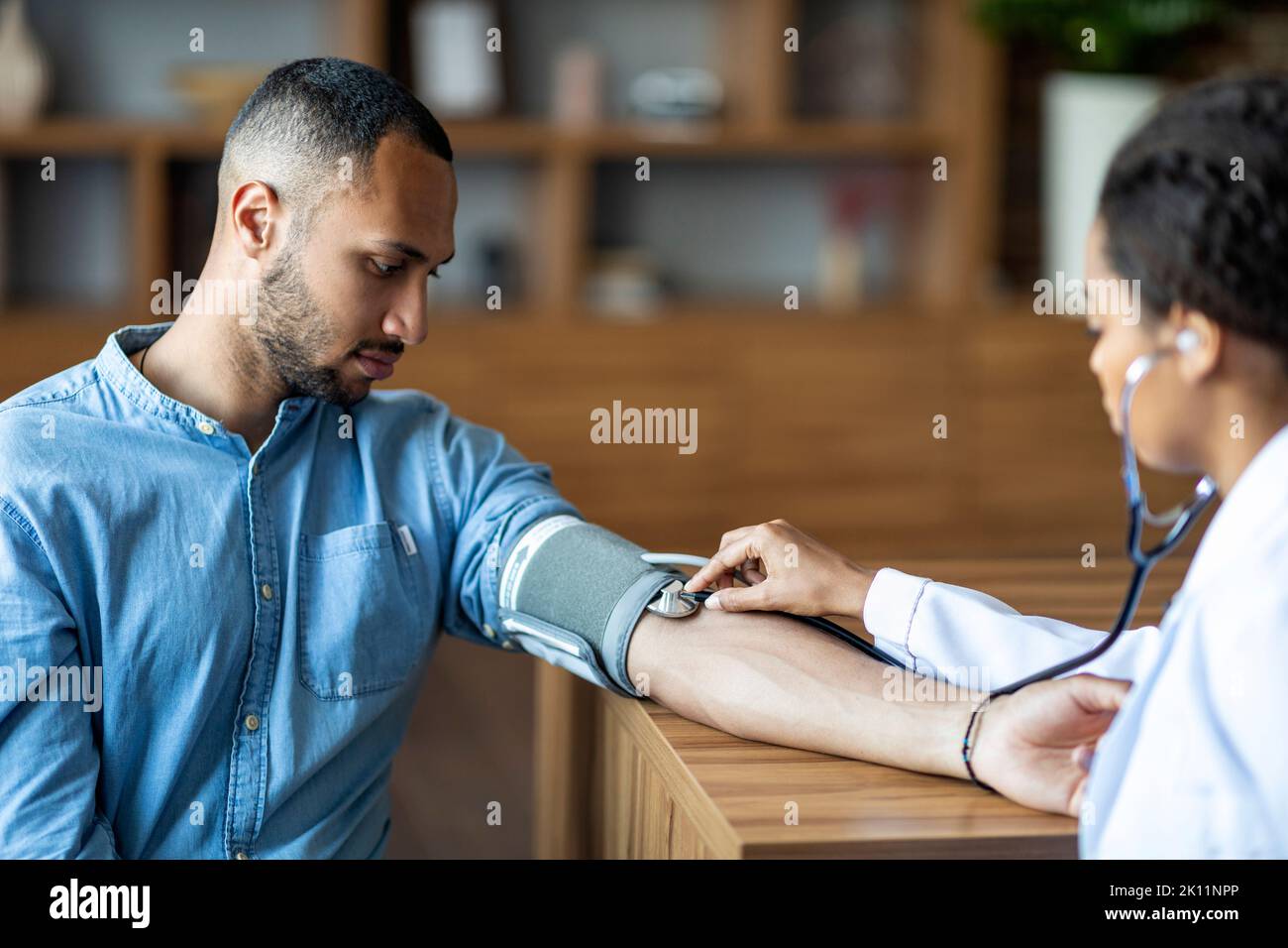 African american young man having regular checkup at practitioner Stock ...