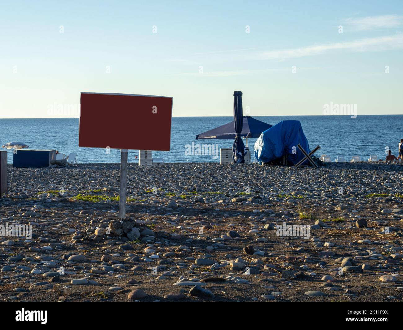 Blank sign on the beach. Mocap. Place for an inscription on the ...