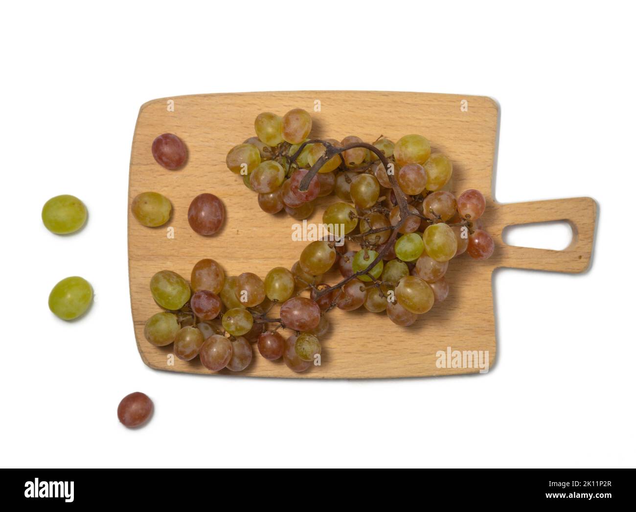 Grapes on the table. White background. Kishmish on a white background ...
