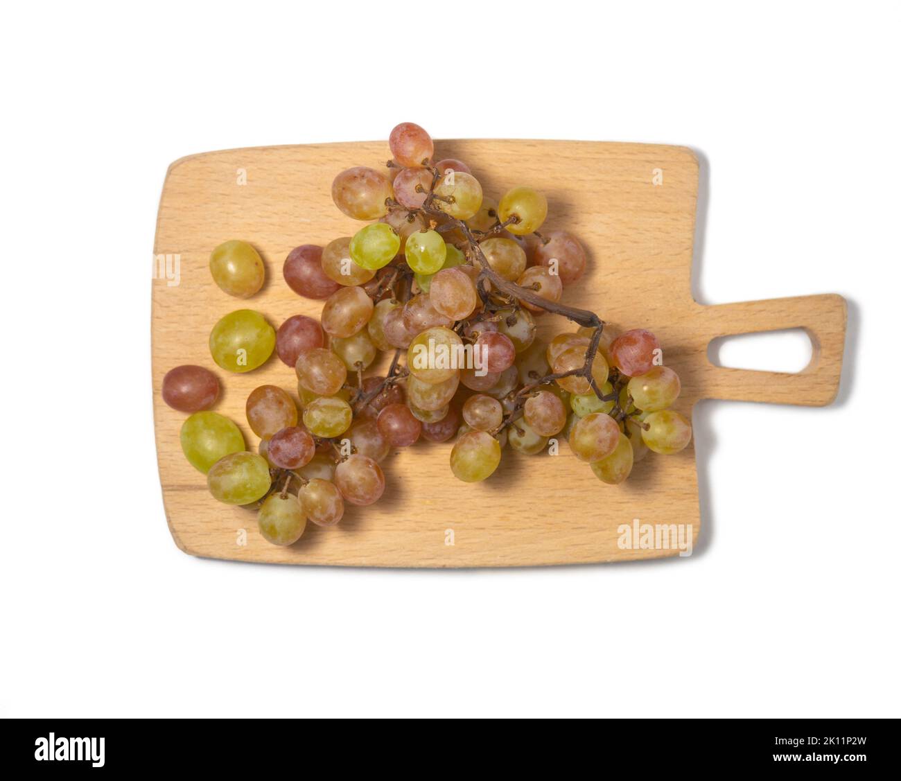 Grapes on the table. White background. Kishmish on a white background ...