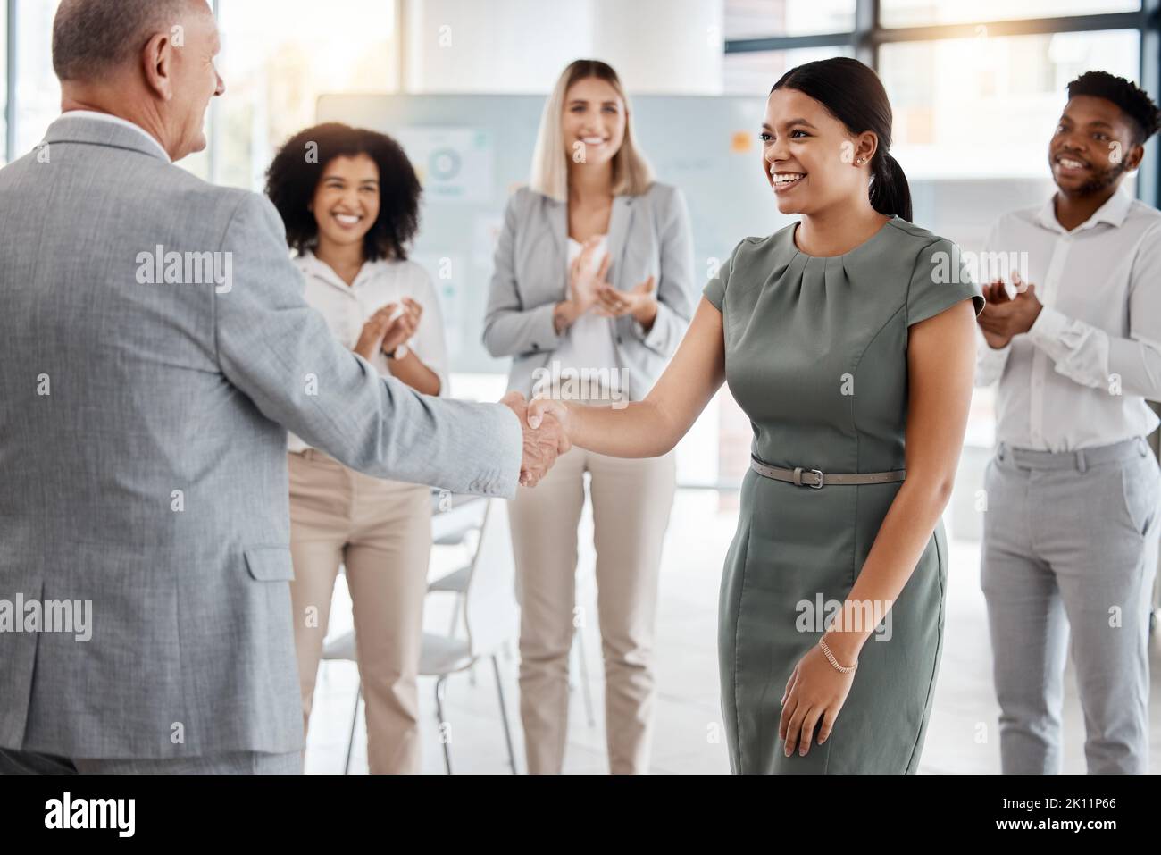 Happy handshake, by man and woman in office, for promotion in business ...
