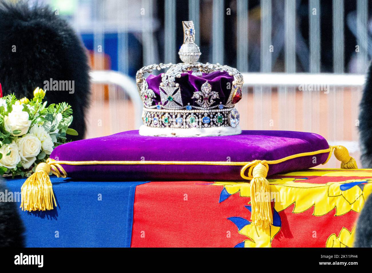 Her Majesty the Queen's crown on top of her coffin as it is transported to the Palace of ...
