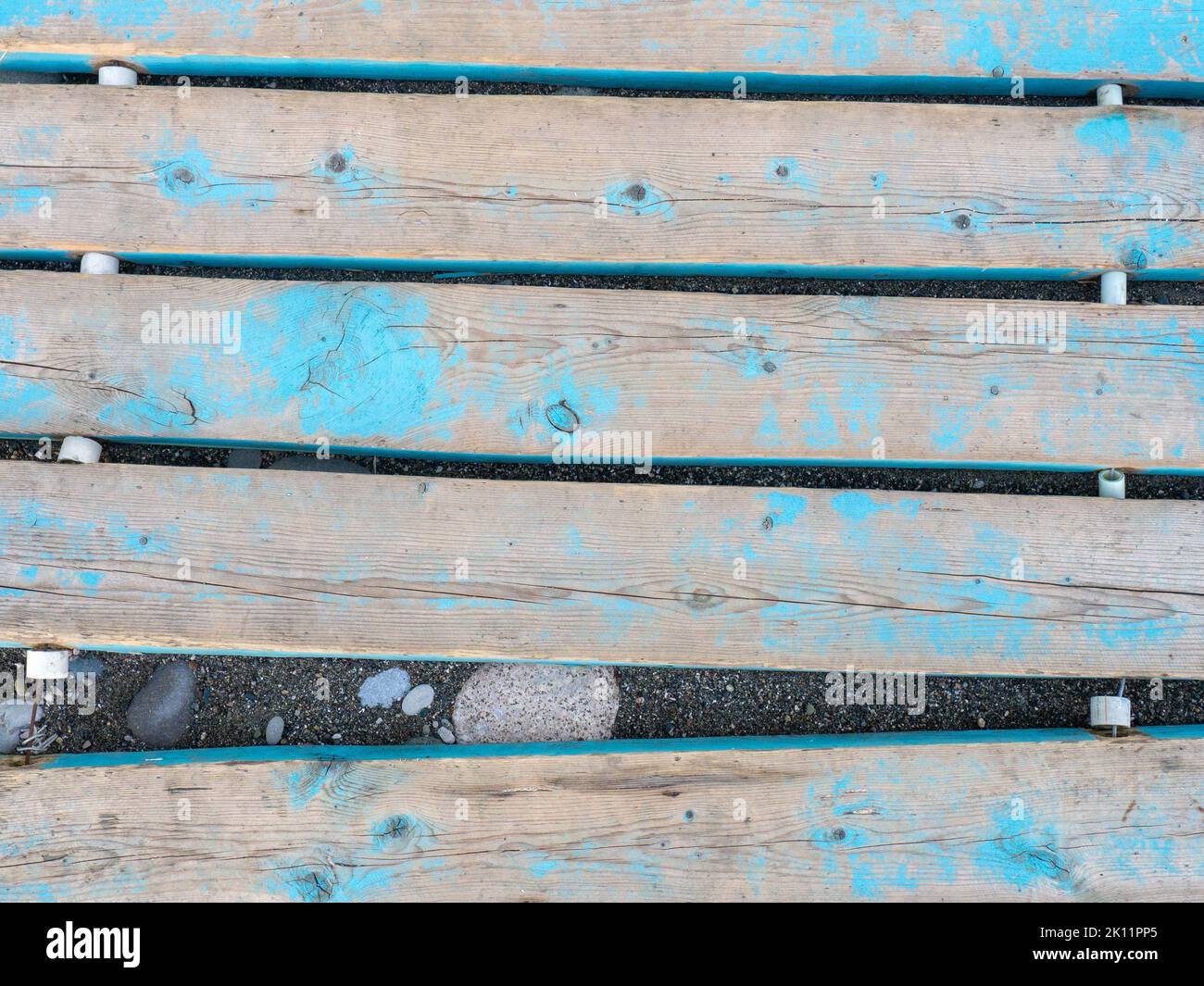 Blue worn boardwalk. Boards leading to the beach. wooden boards. Peeled ...