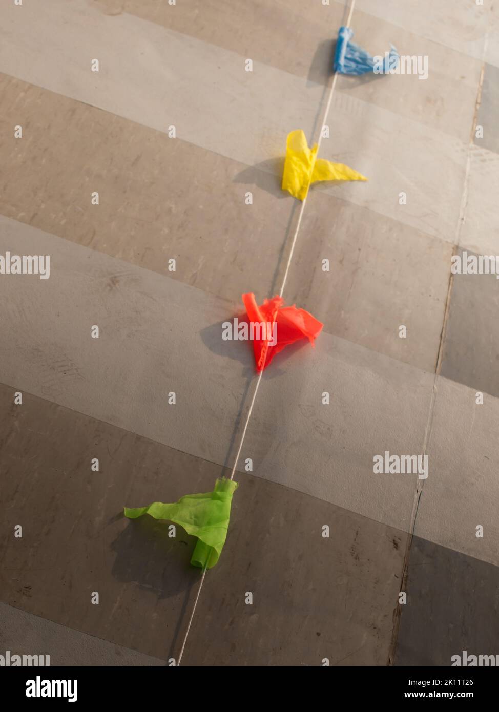 Rope with color flags Stock Photo - Alamy