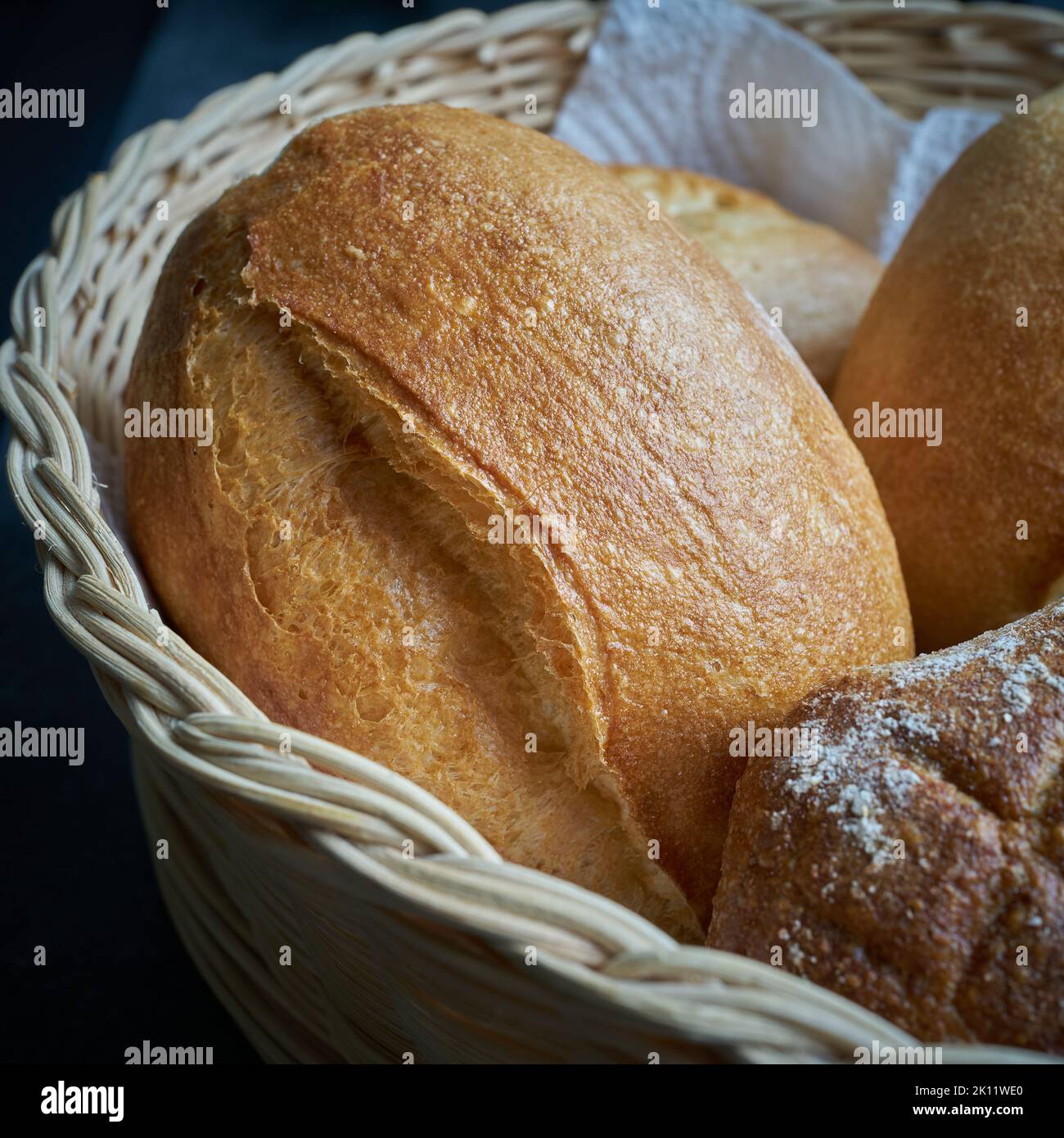 Fresh rolls from the baker for breakfast on a table Stock Photo - Alamy