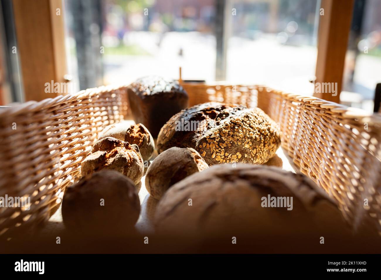 Ready-made artisan bread with seeds on the counter in a small bakery ...