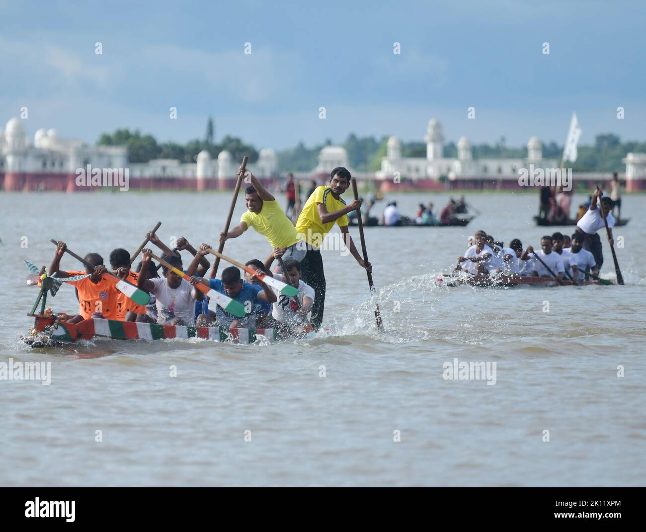 Boats compete at the annual boat-racing festival on the Rudrasagar Lake ...