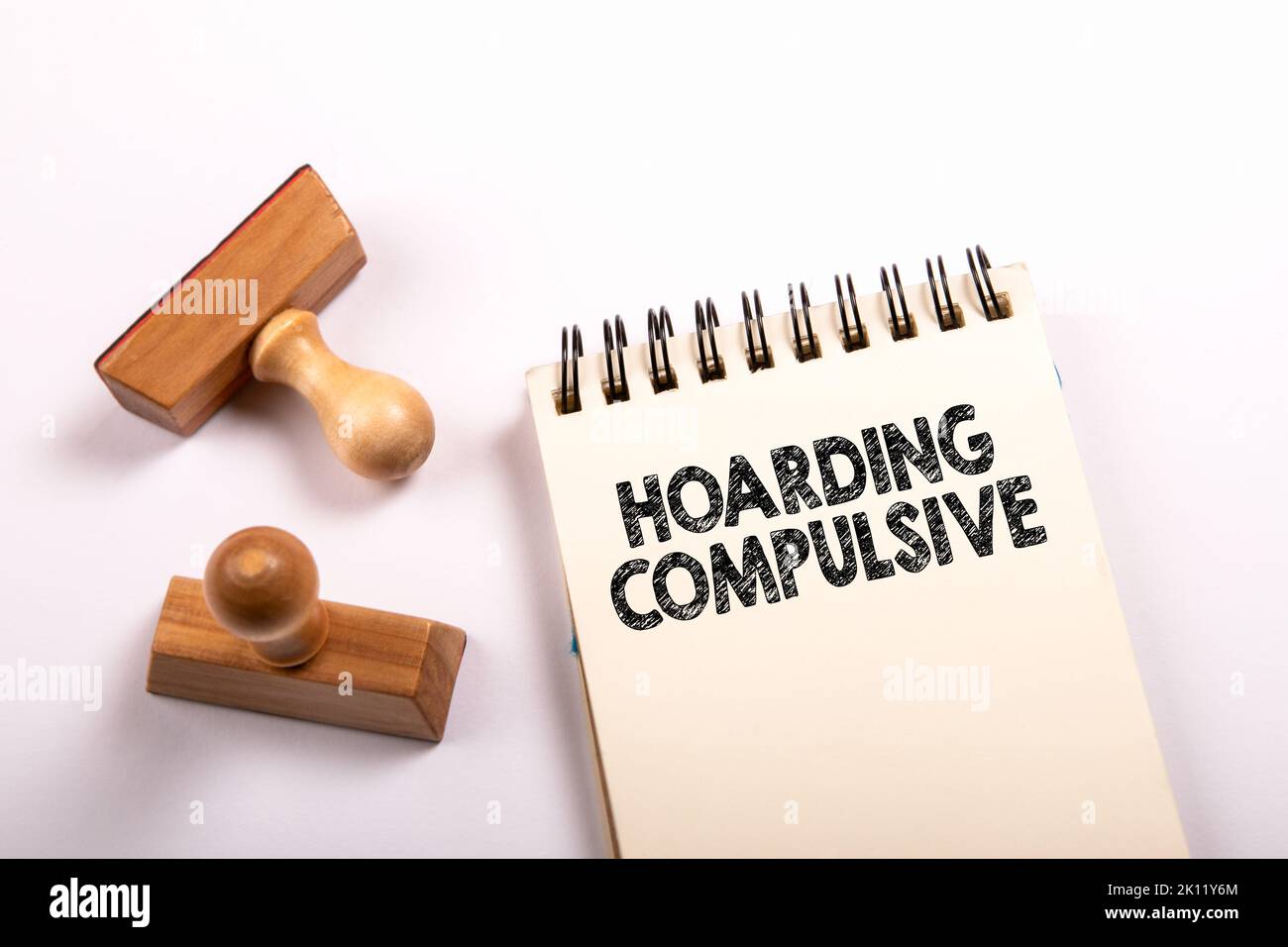 Hoarding Compulsive text written on a notebook. Stamps on a white ...