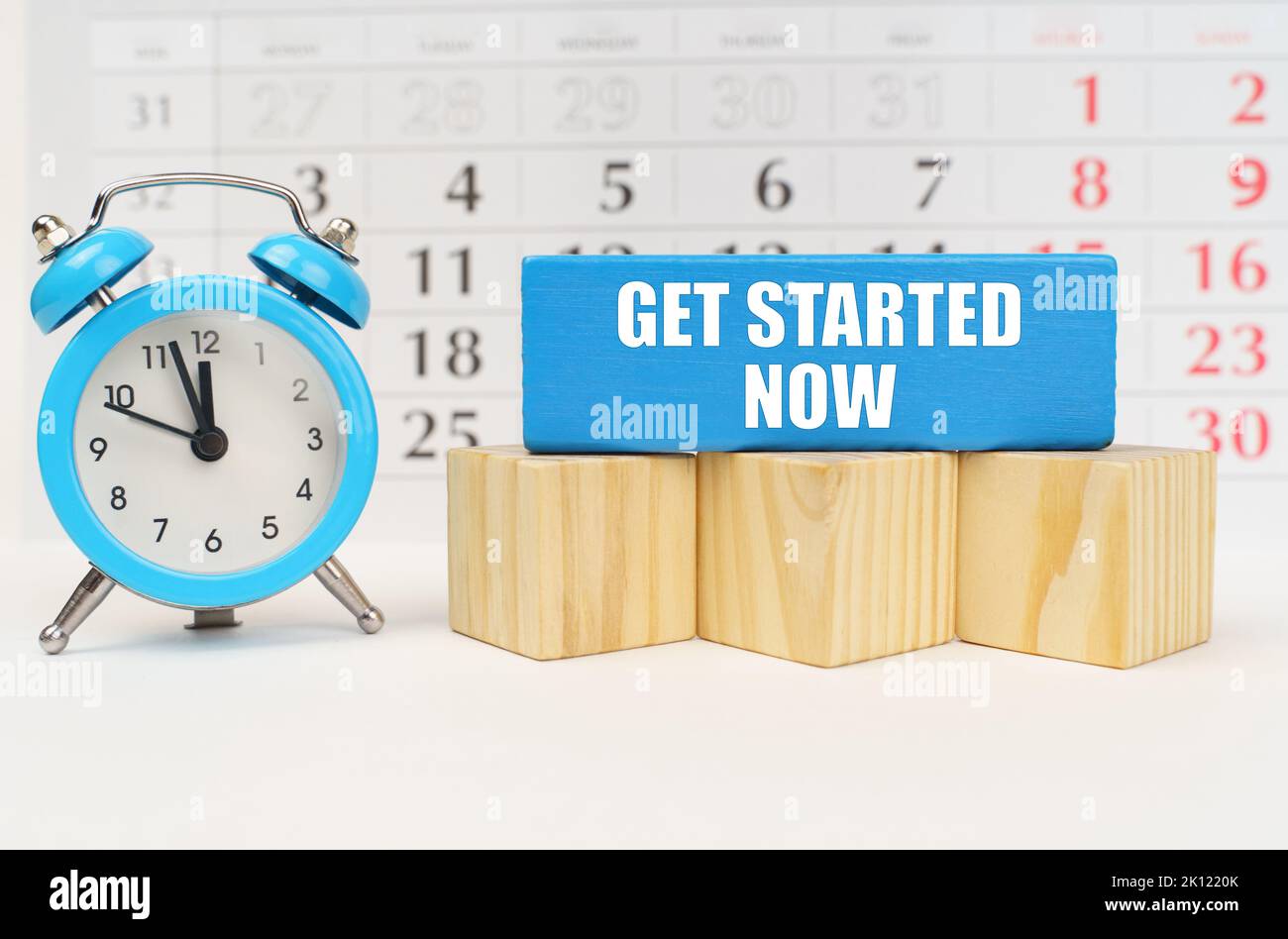 Time concept. Against the background of the calendar is an alarm clock ...