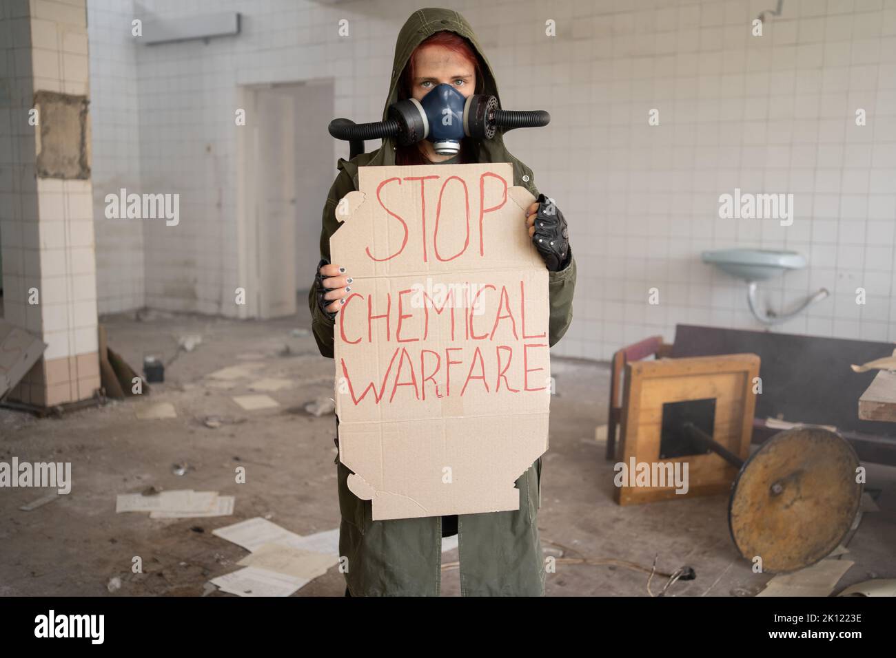 Photo of a military woman in a gas mask with banner says stop chemical ...