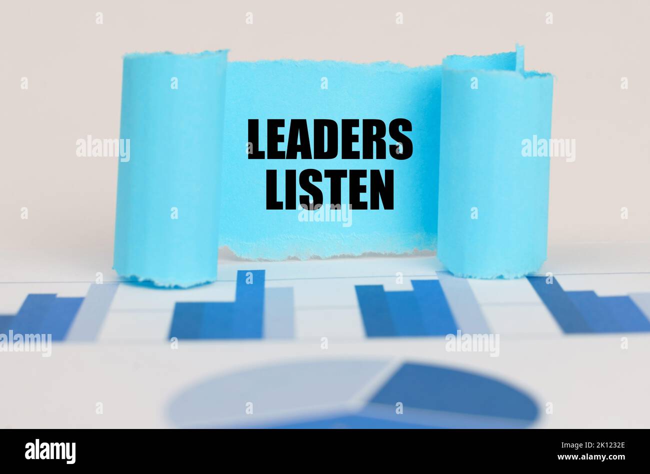 Business concept. On the blue diagram and graphs there is a twisted ...