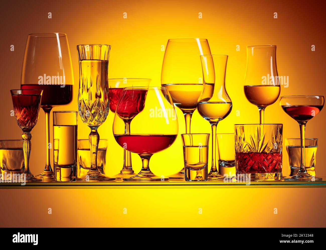 Various alcoholic drinks in the bar on a yellow background Stock Photo ...