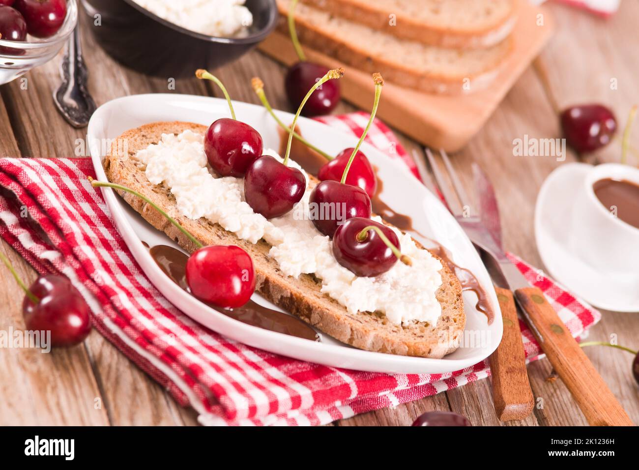 Rye bread with cottage cheese and cherries Stock Photo - Alamy
