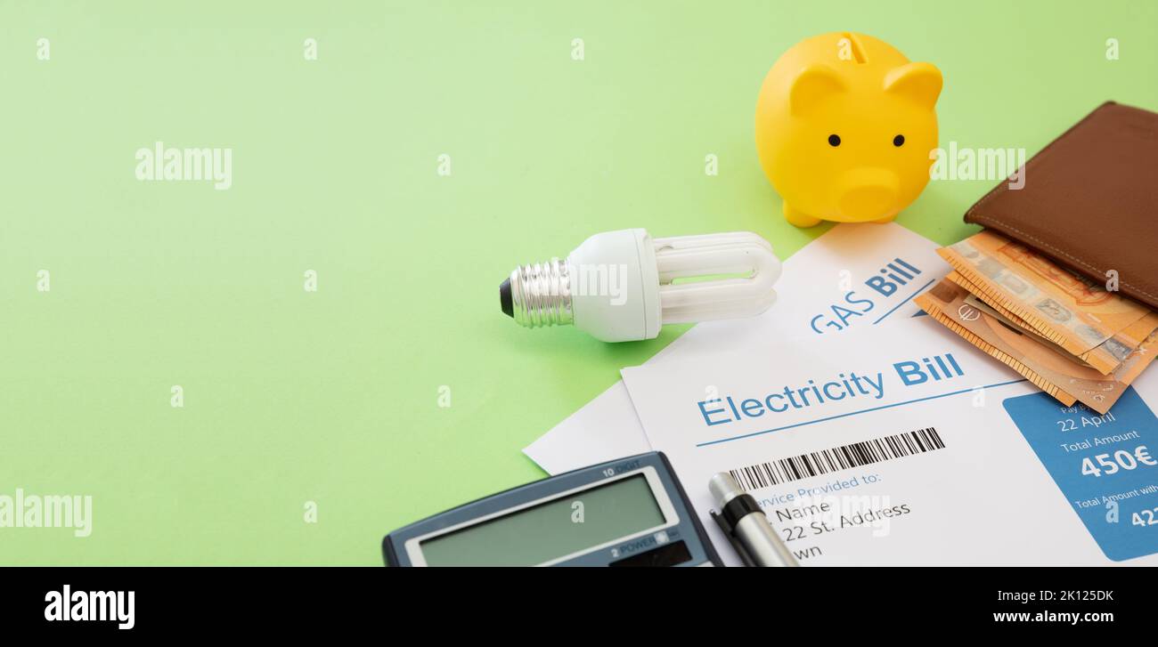 Electricity and gas bills, euro banknotes, light bulb and piggy bank ...