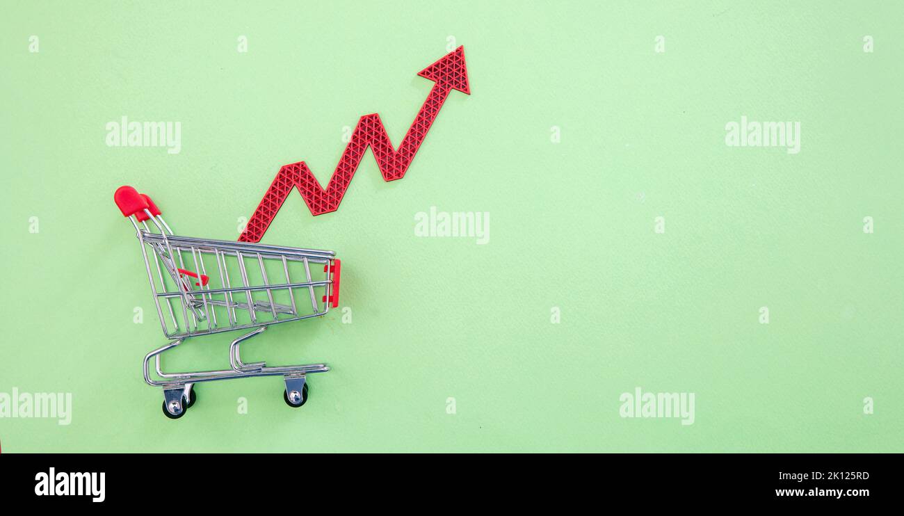 Groceries price up, food rising cost. Shopping cart and red arrow up ...