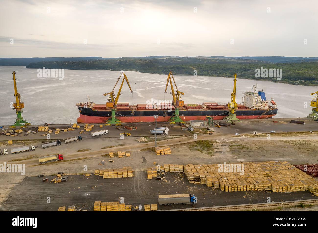 Aerial view from drone of loading the cargo ship. Work in port Stock ...