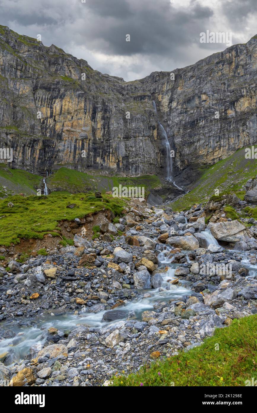 Typical alpine landscape with waterfalls, Swiss Alps near ...