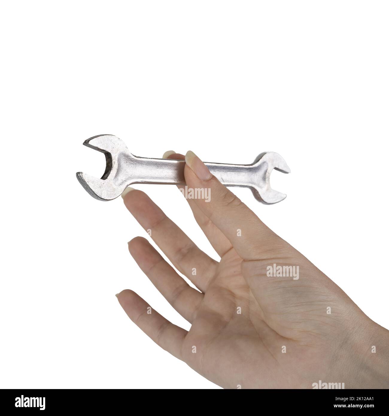 a wrench in a female hand on a white background Stock Photo - Alamy