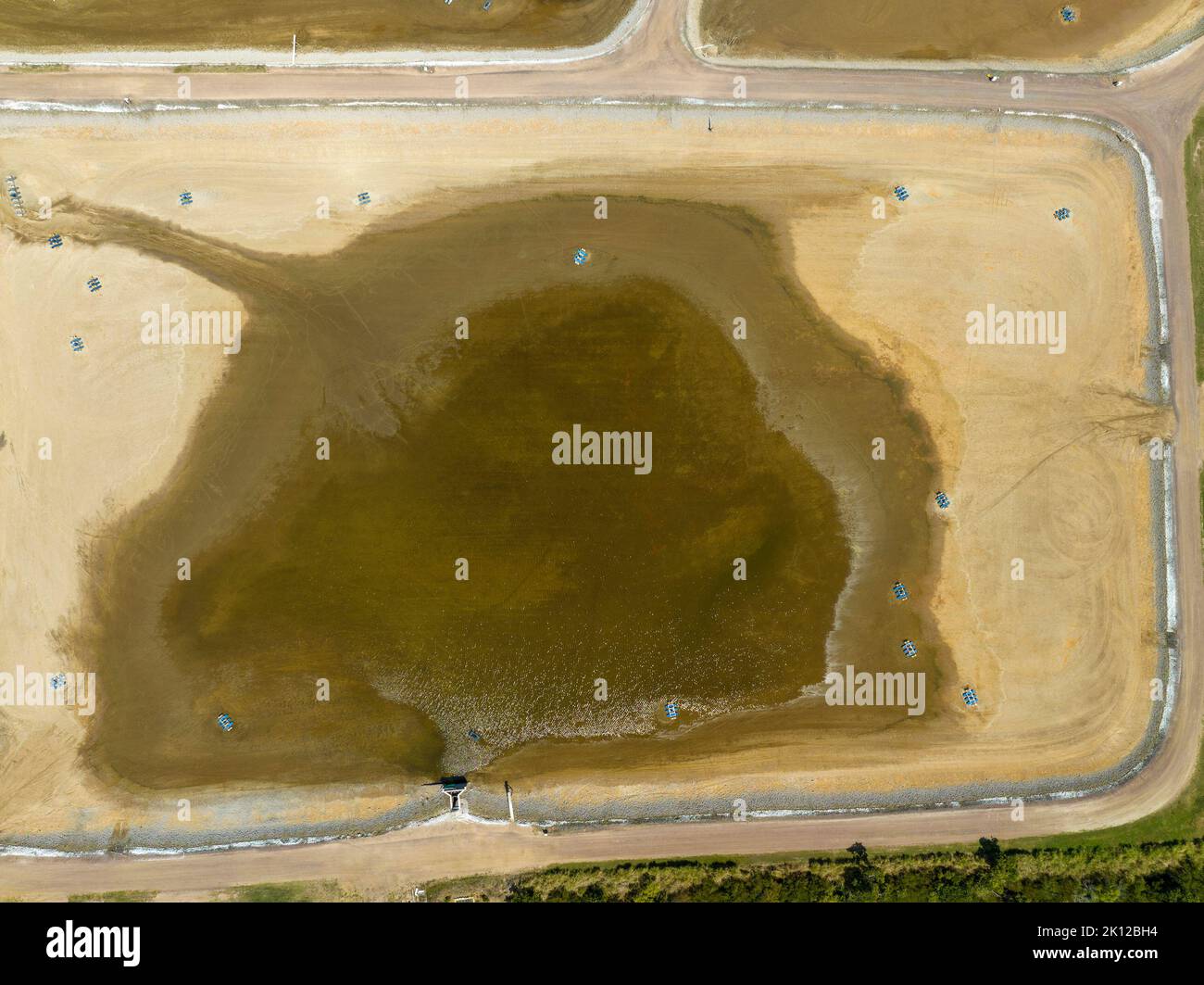 Empty pond at a prawn farm closed for the winter season. Drone aerial ...