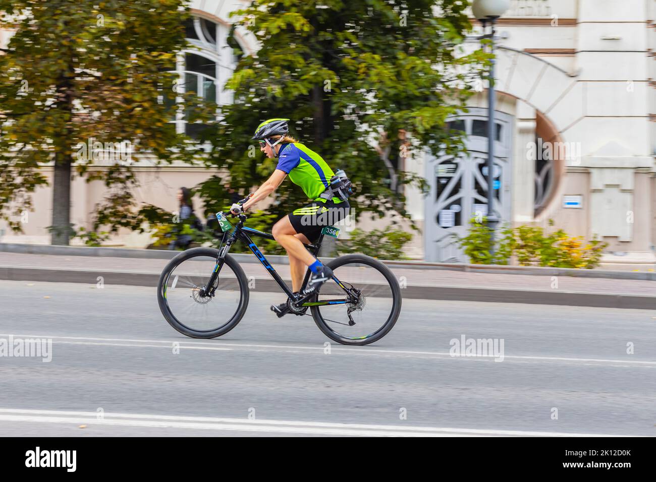 Female sportsman cyclist riding racing bicycle Tomsk Russia September ...