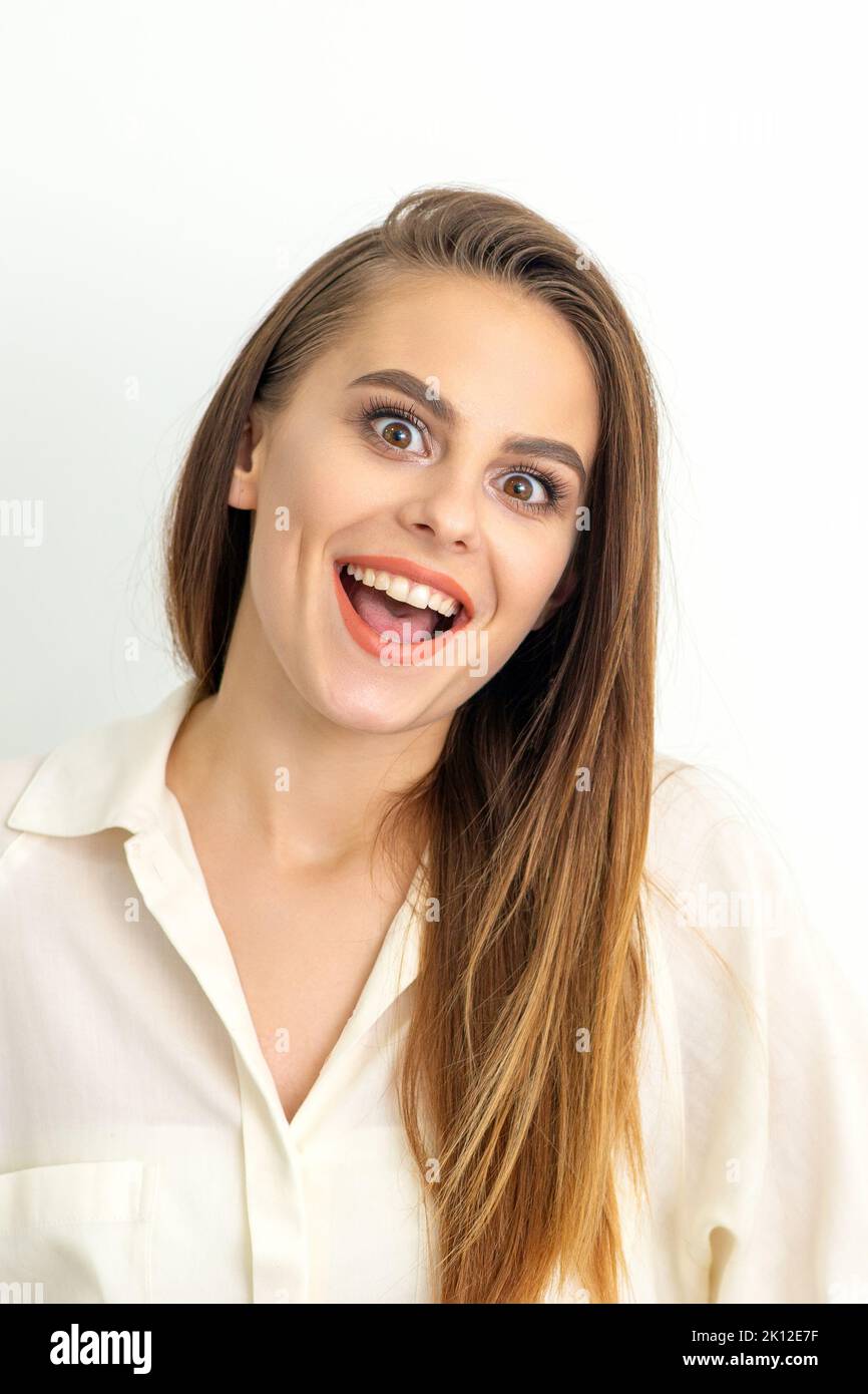Portrait Of A Young Caucasian Happy Woman Wearing White Shirt Smiling