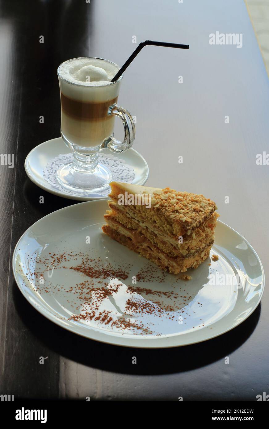 Dessert with sweet napoleon cake and cream coffee served at ...