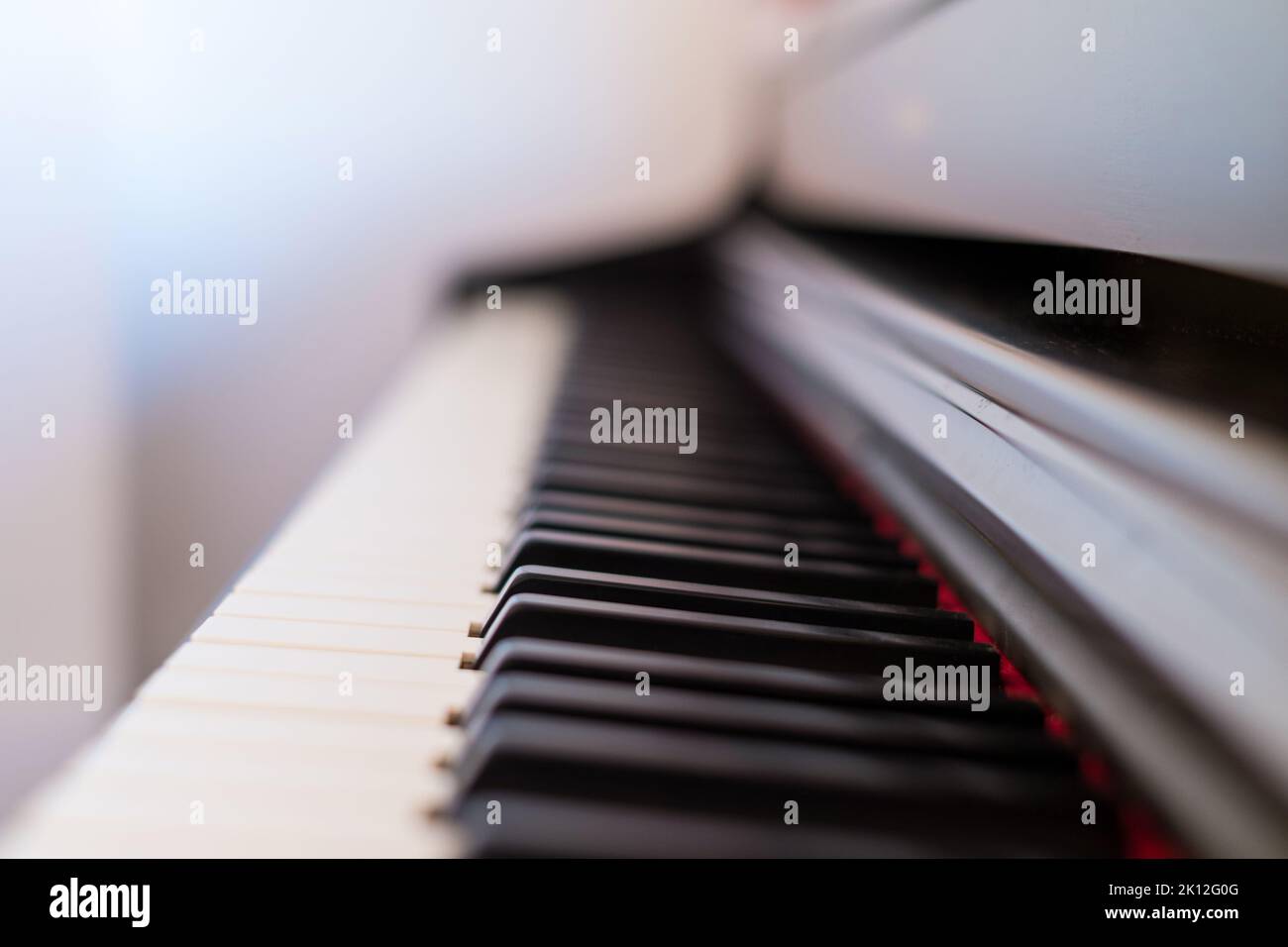 Classic grand piano keyboard close-up. Close-up of a wooden piano and ...