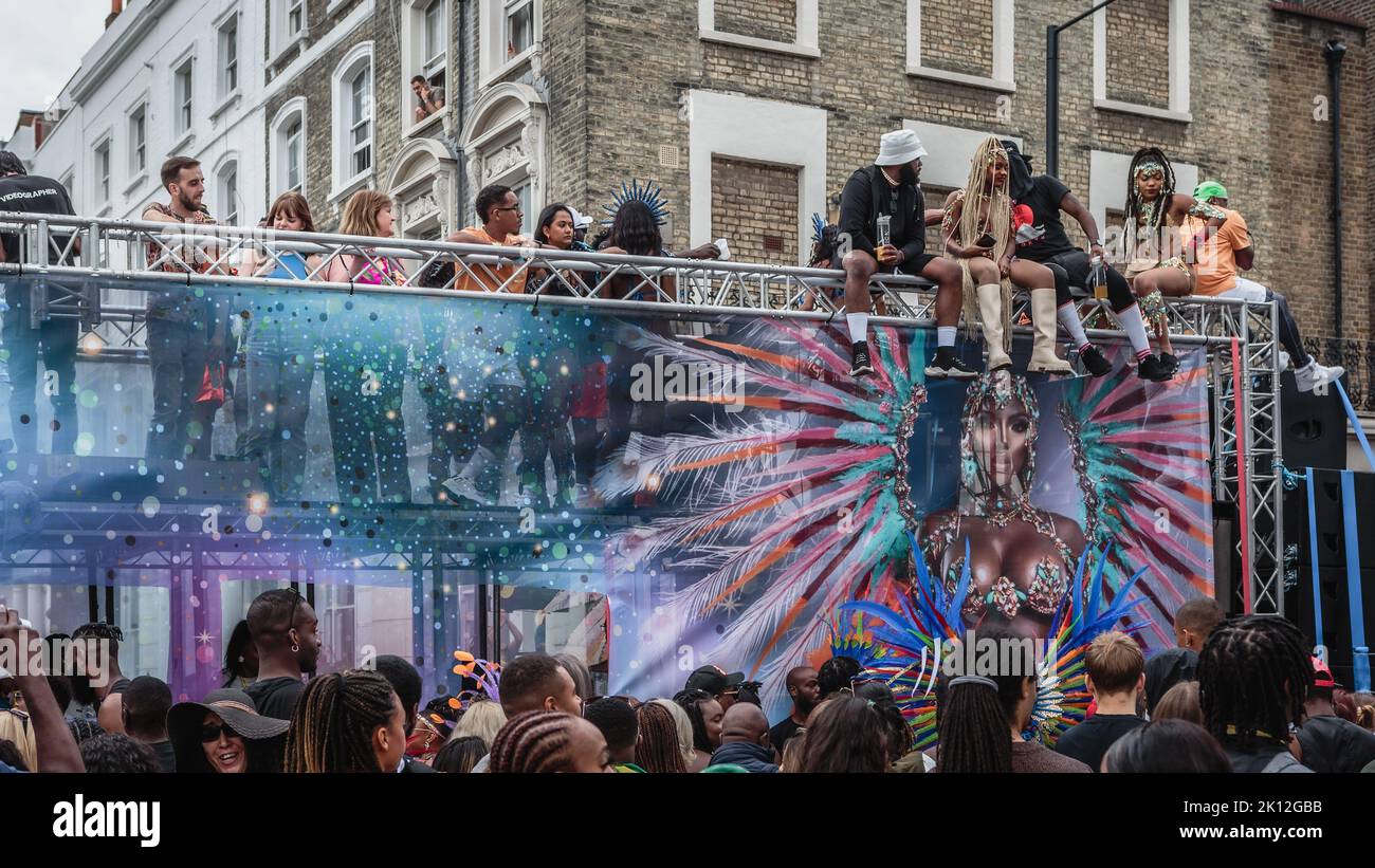 Great colour of revellers atop a float at the Notting Hill Carnival ...