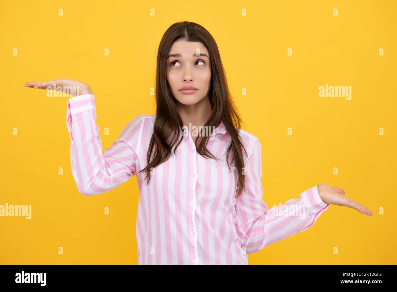 Woman point at copy space, showing copyspace pointing. Promo, girl ...