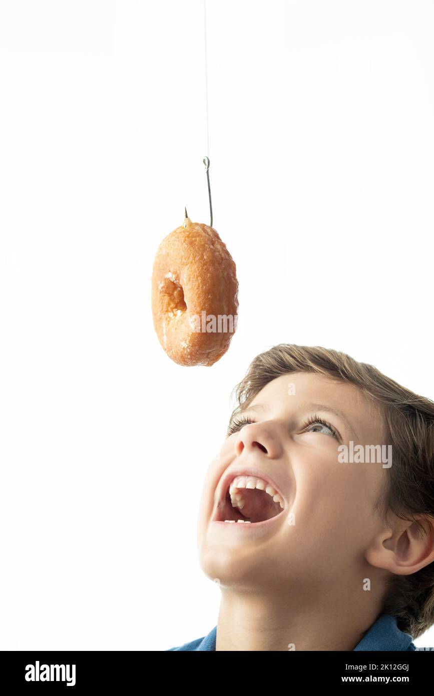 Hanging from a hook hi-res stock photography and images - Alamy