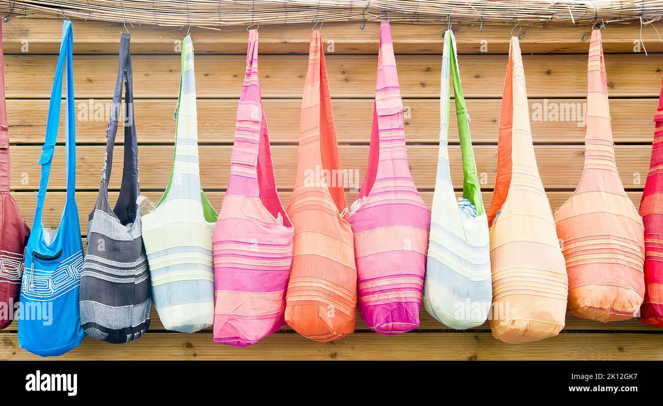 The colorful shopping bags as souvenirs for tourists in Psychro, Crete ...
