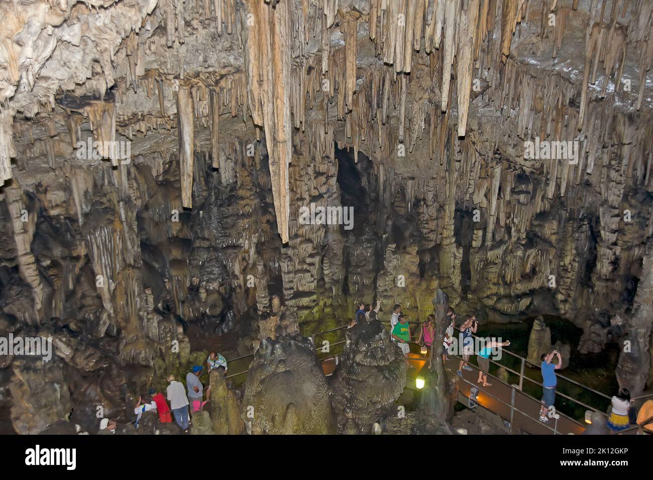 Tourists observe the Psychro Cave on Crete, Greece Stock Photo - Alamy