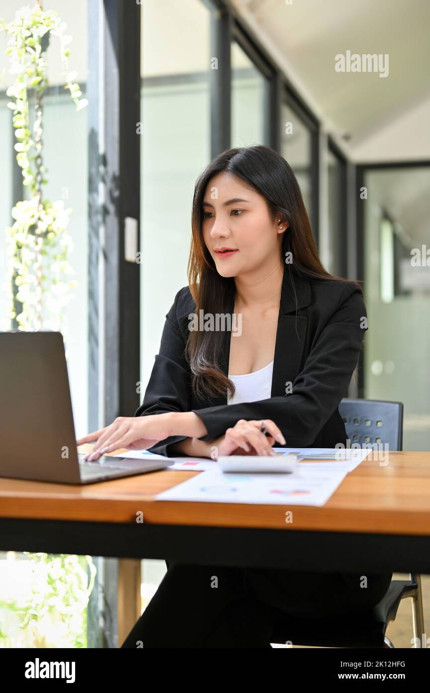 Beautiful female accountant analyzing hi-res stock photography and ...