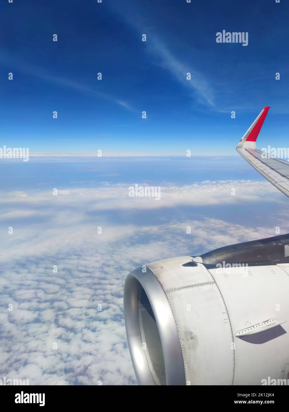Airplane Wing shooting through the window aircraft during flight with a ...