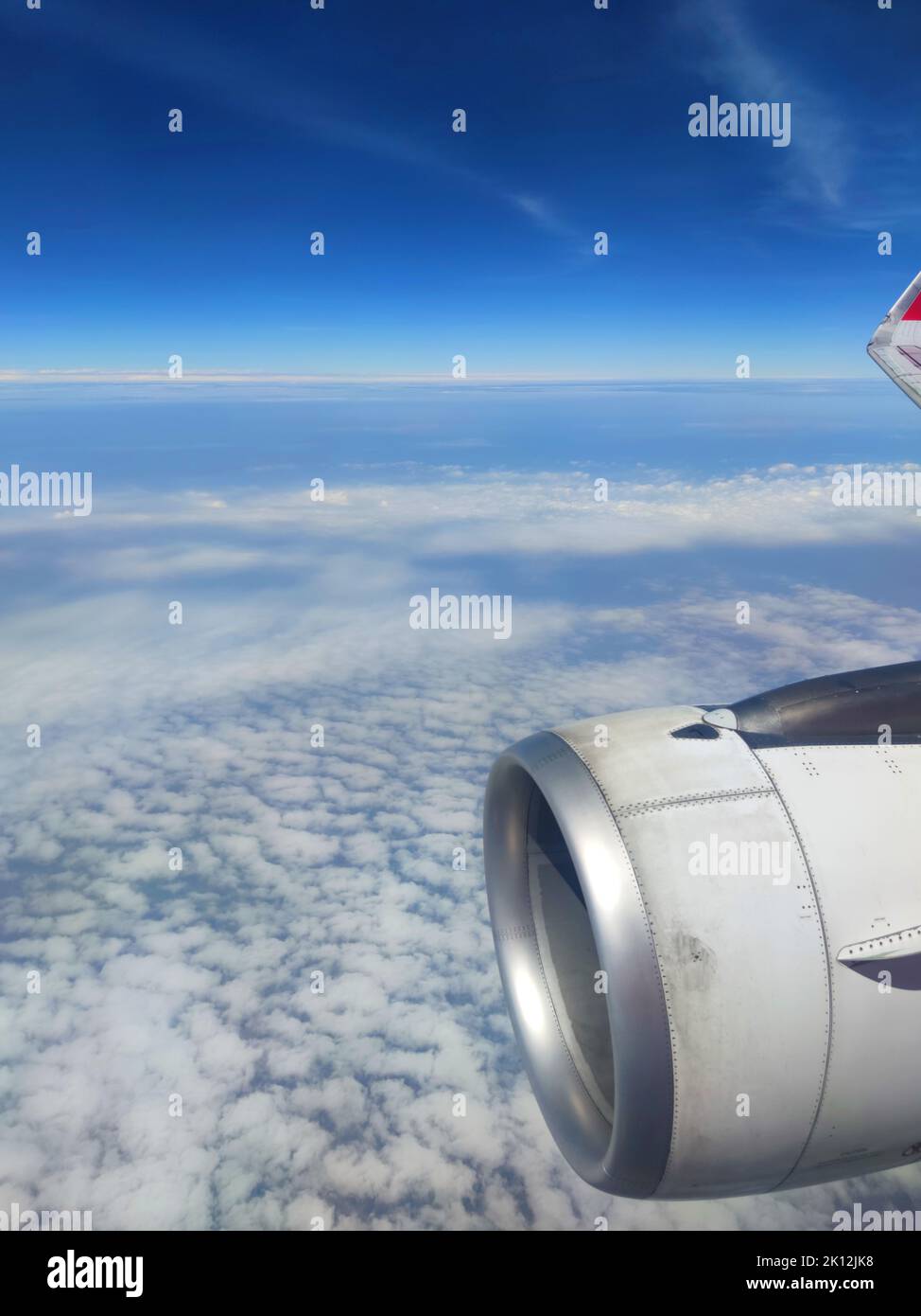 Airplane Wing shooting through the window aircraft during flight with a ...