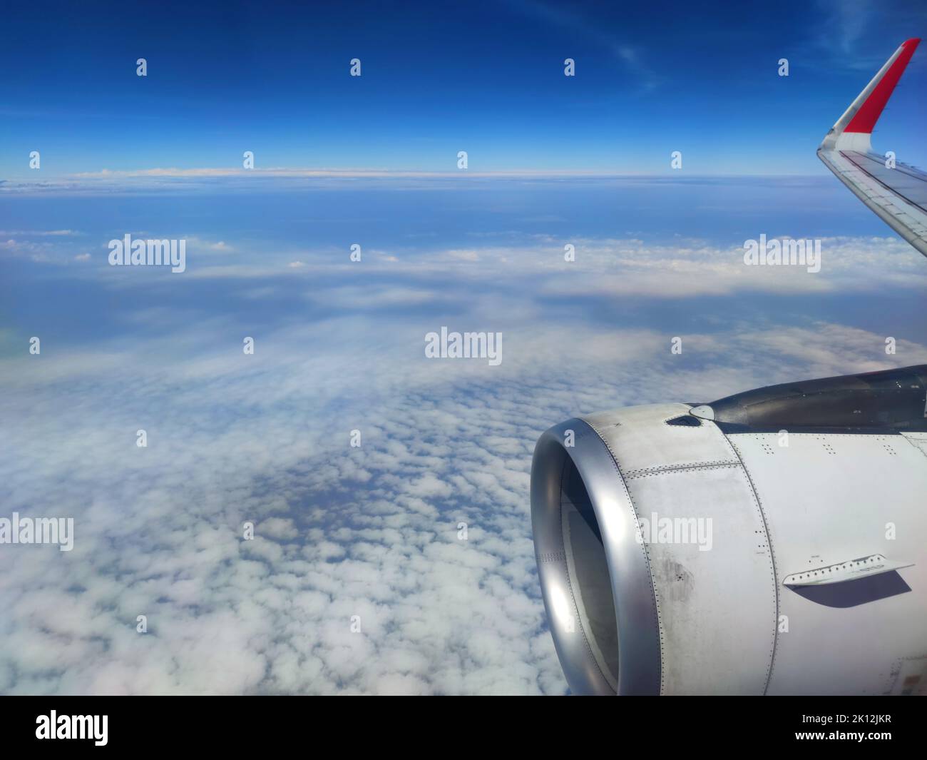 Airplane Wing shooting through the window aircraft during flight with a ...