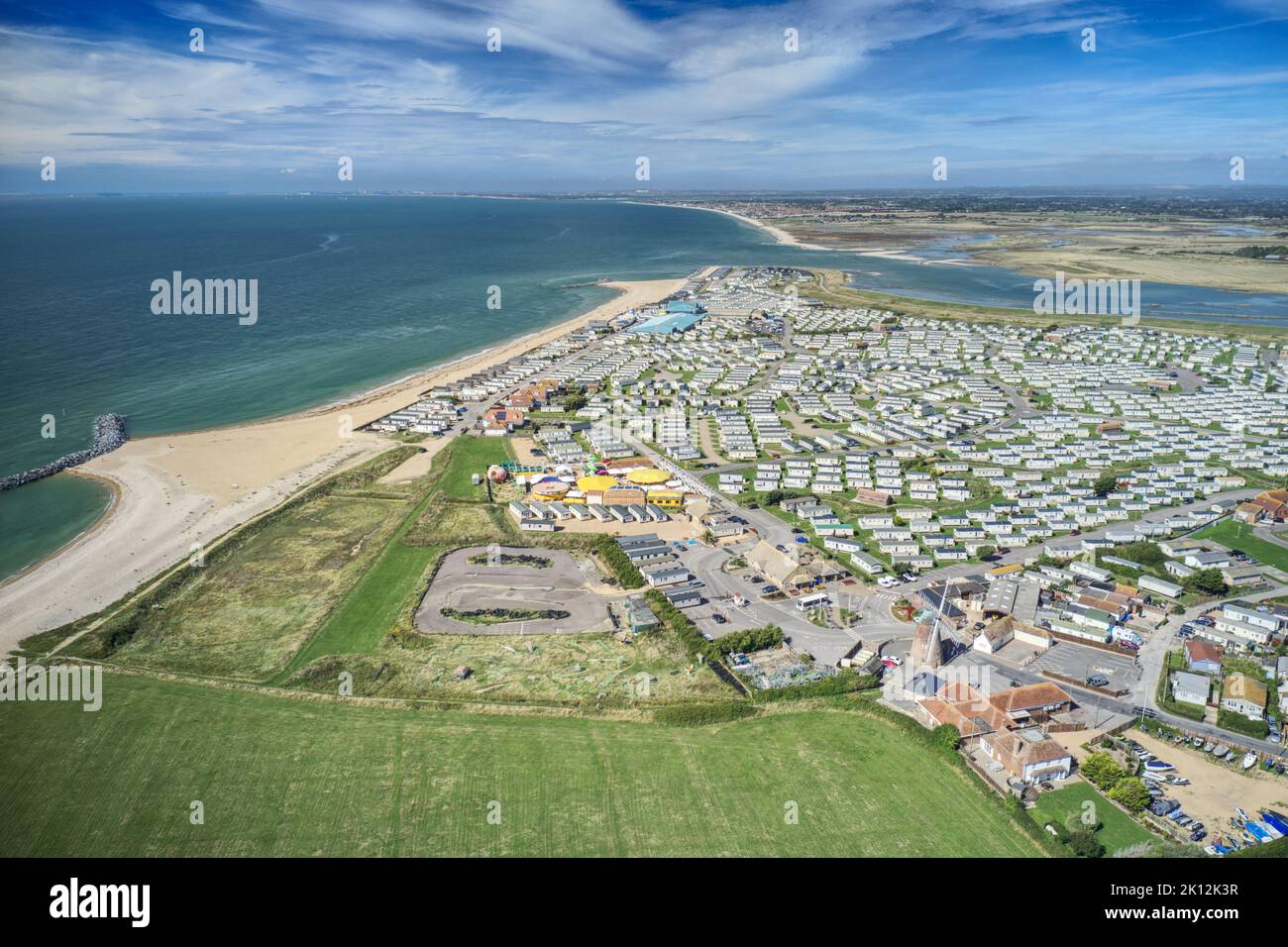 Aerial photo West Sands at Selsey in West Sussex with a large holiday ...